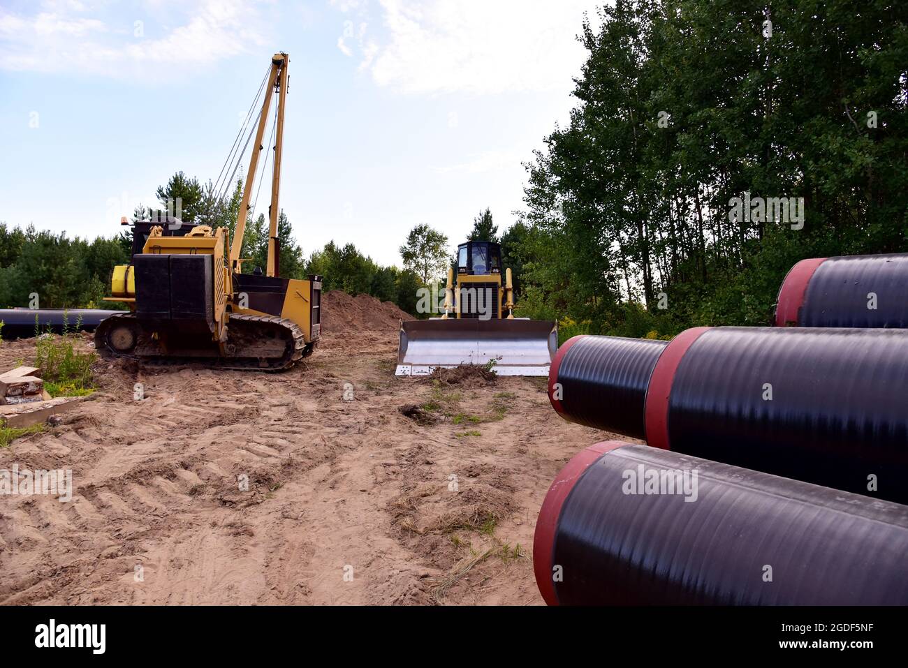 Natural gas pipeline construction work. Crawler crane with side boom ...