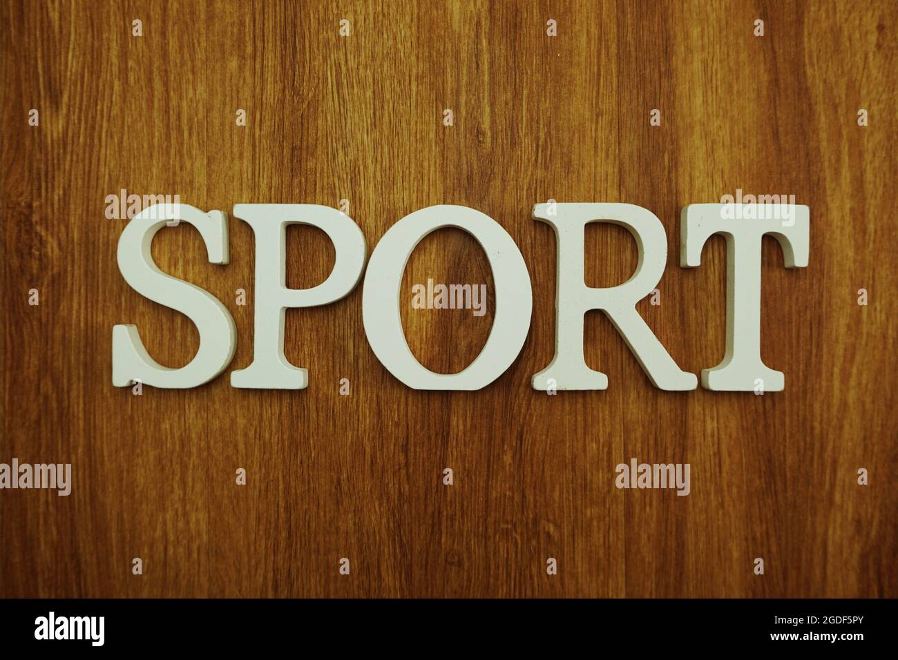 Sport alphabet letters on wooden background Stock Photo - Alamy