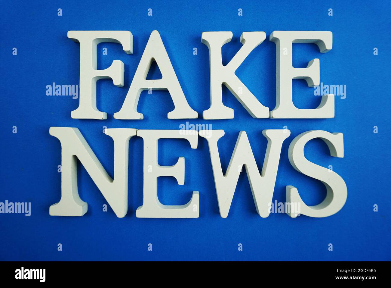 Fake News alphabet letters on blue background Stock Photo - Alamy
