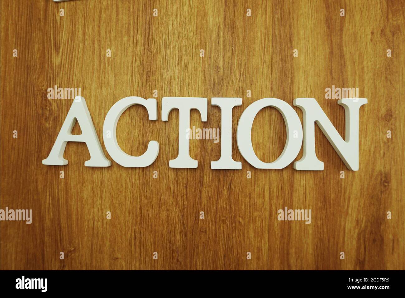 Action alphabet letters on wooden background Stock Photo - Alamy