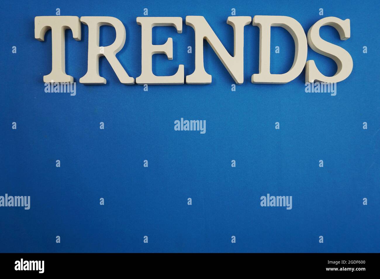 Top view of Trends alphabet letters on blue background Stock Photo - Alamy