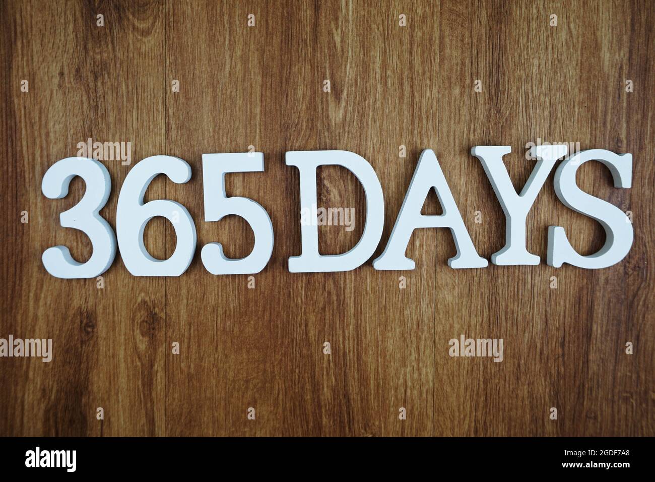 365 Days alphabet letters on wooden background Stock Photo - Alamy