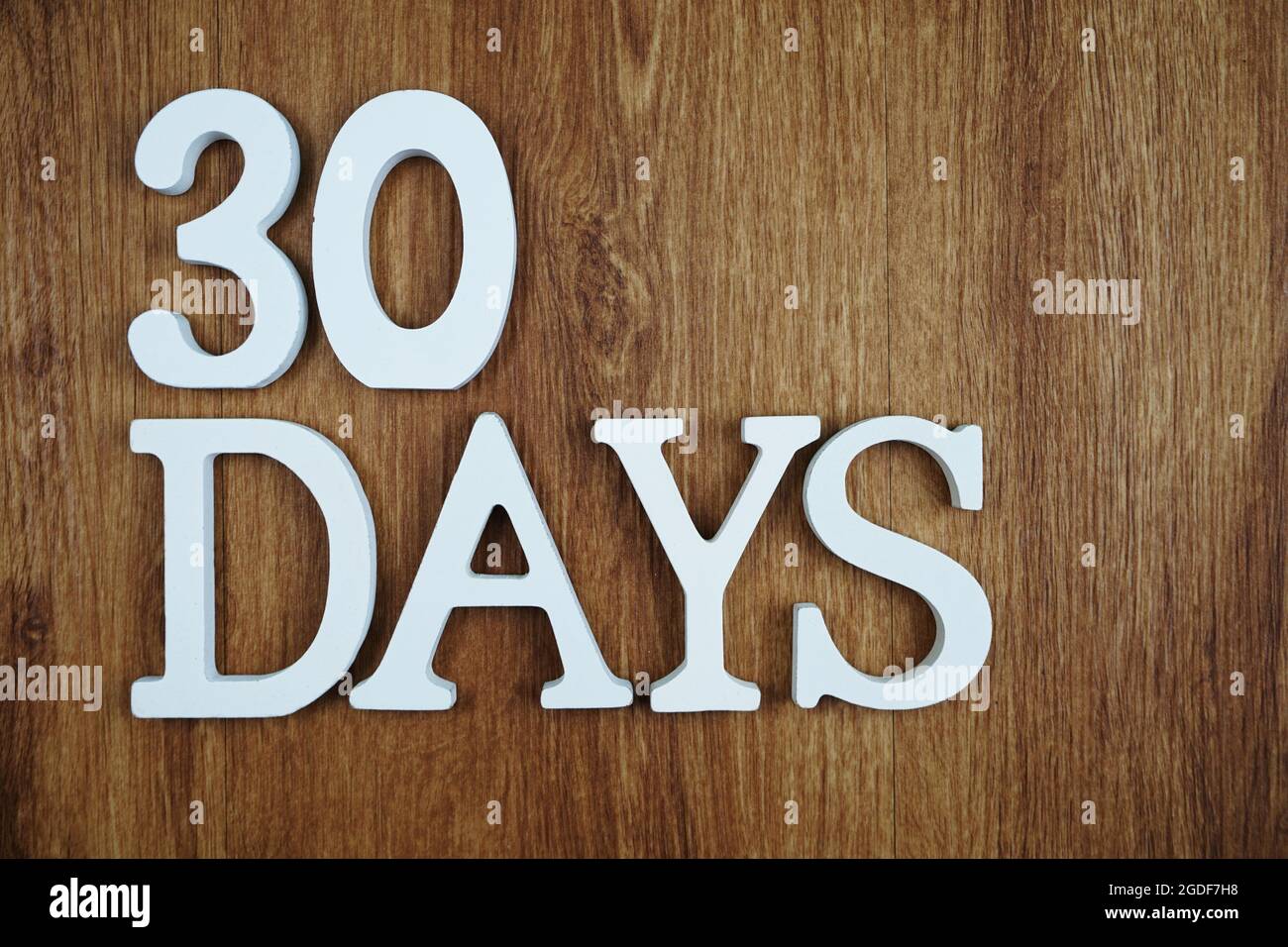 30 Days alphabet letters on wooden background Stock Photo - Alamy