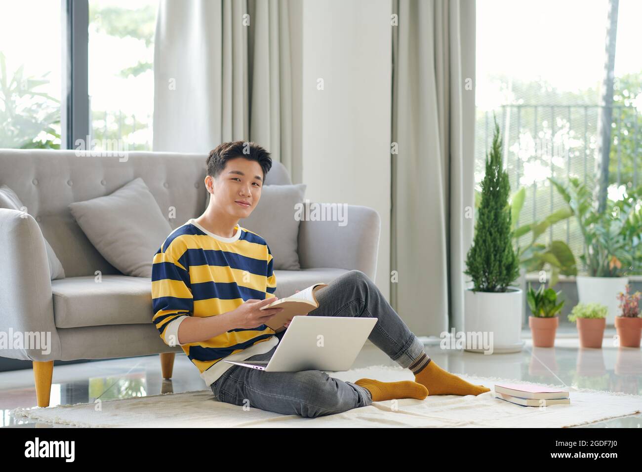 Man drawing in notebook at online lesson indoors. Distance learning ...
