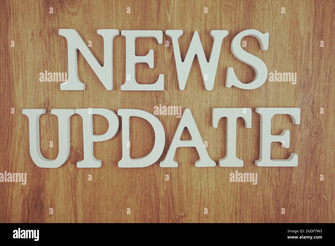 News Update alphabet letters on wooden background Stock Photo - Alamy