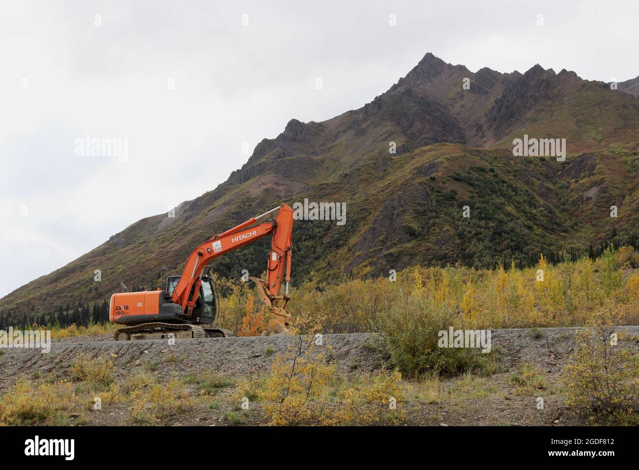 Bagger in orange hi-res stock photography and images - Alamy
