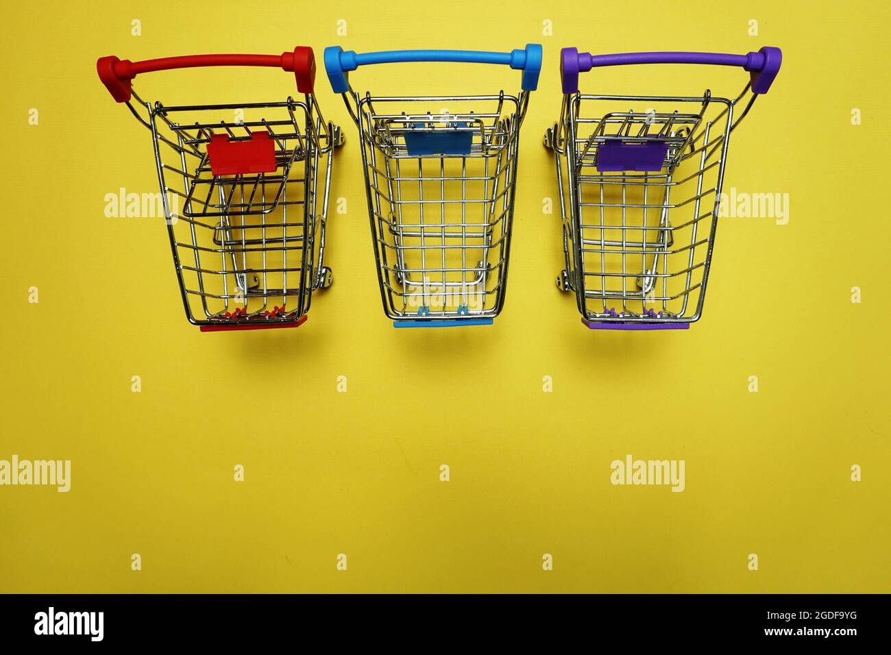 Mini trolley cart with space copy on yellow background Stock Photo - Alamy