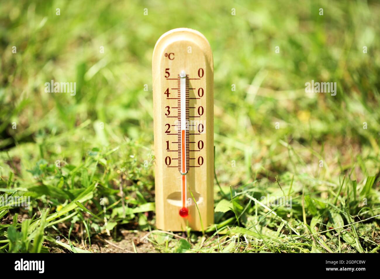 Thermometer on grass close-up Stock Photo - Alamy