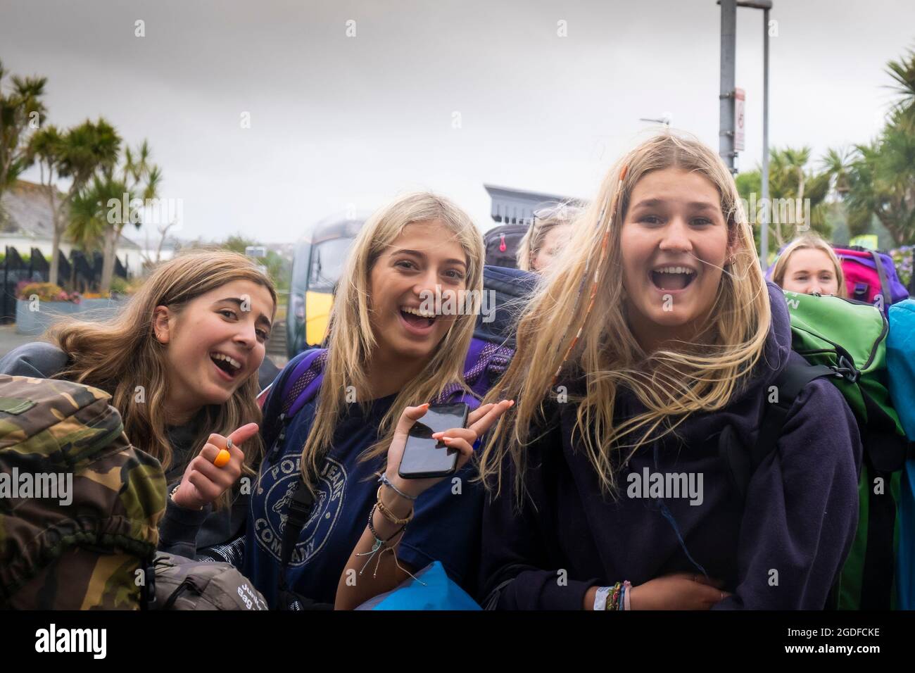 A group of excited young girls arriving at Newquay Train Station for ...