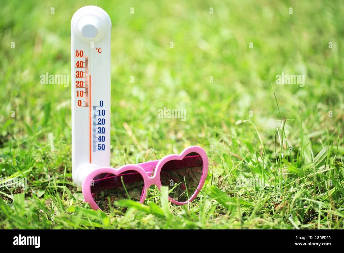 Thermometer on grass close-up Stock Photo - Alamy