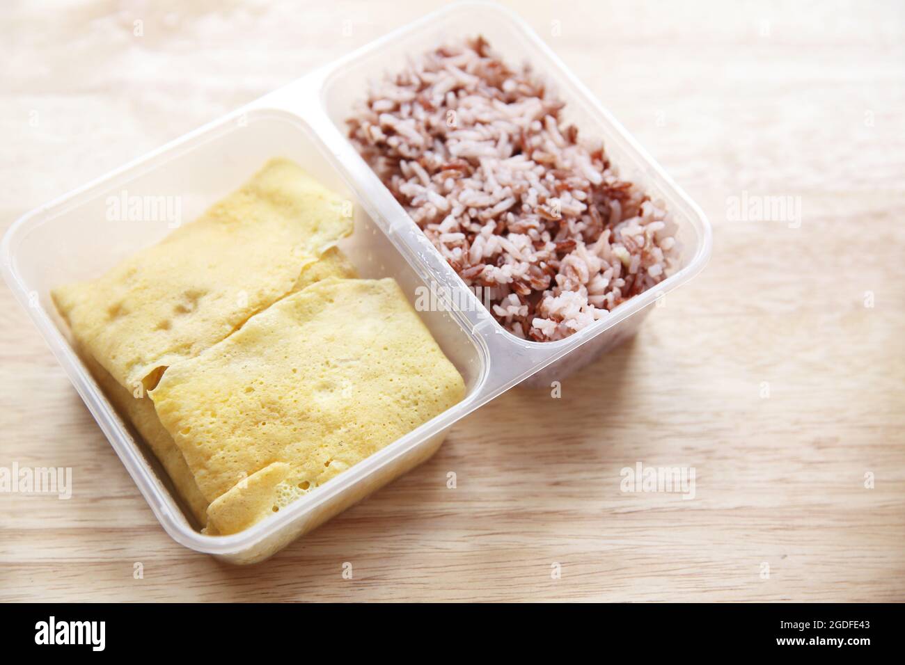 Clean food rice with Chicken stuffed omelette Stock Photo - Alamy