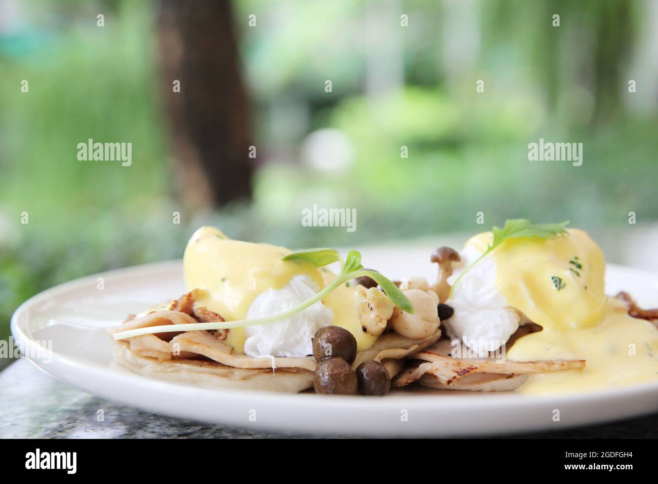 egg benedict with bread and bacon Stock Photo - Alamy