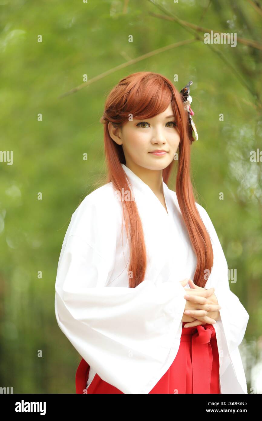Asian girl portrait , Japanese Miko in nature Stock Photo - Alamy