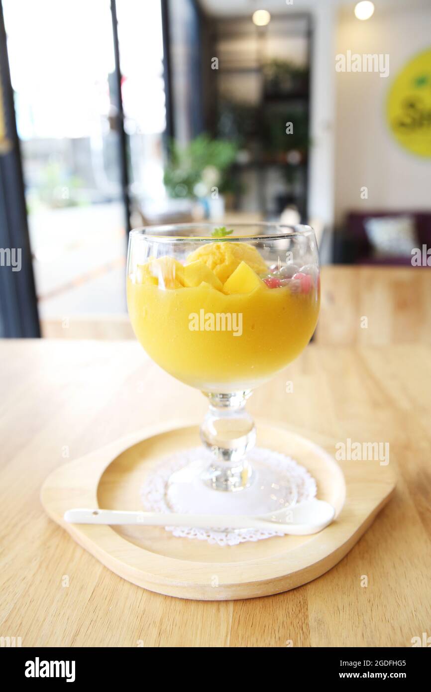 Scoops of mango ice cream with fruit Stock Photo - Alamy