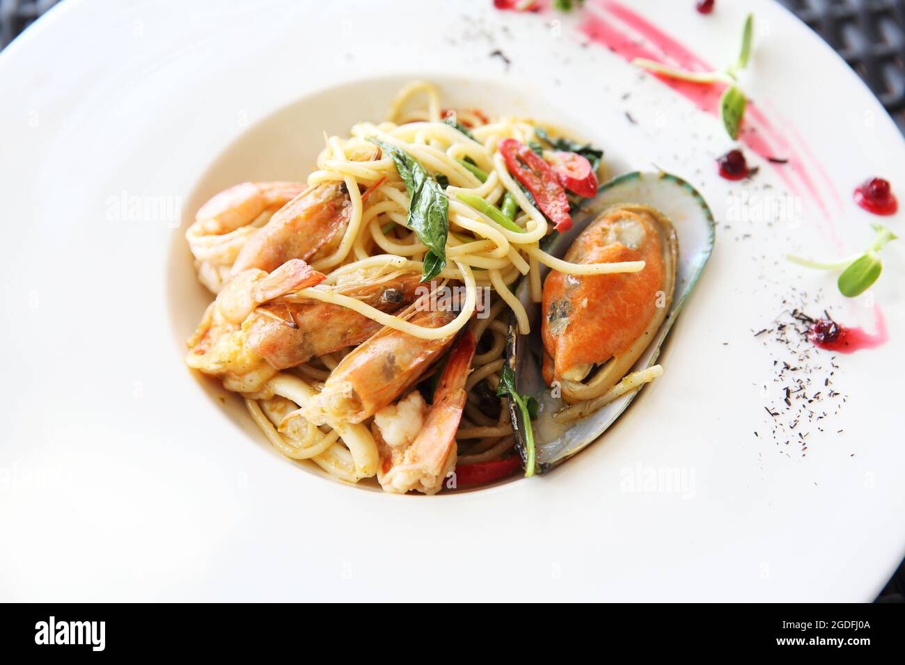Spaghetti seafood with spicy Stock Photo - Alamy
