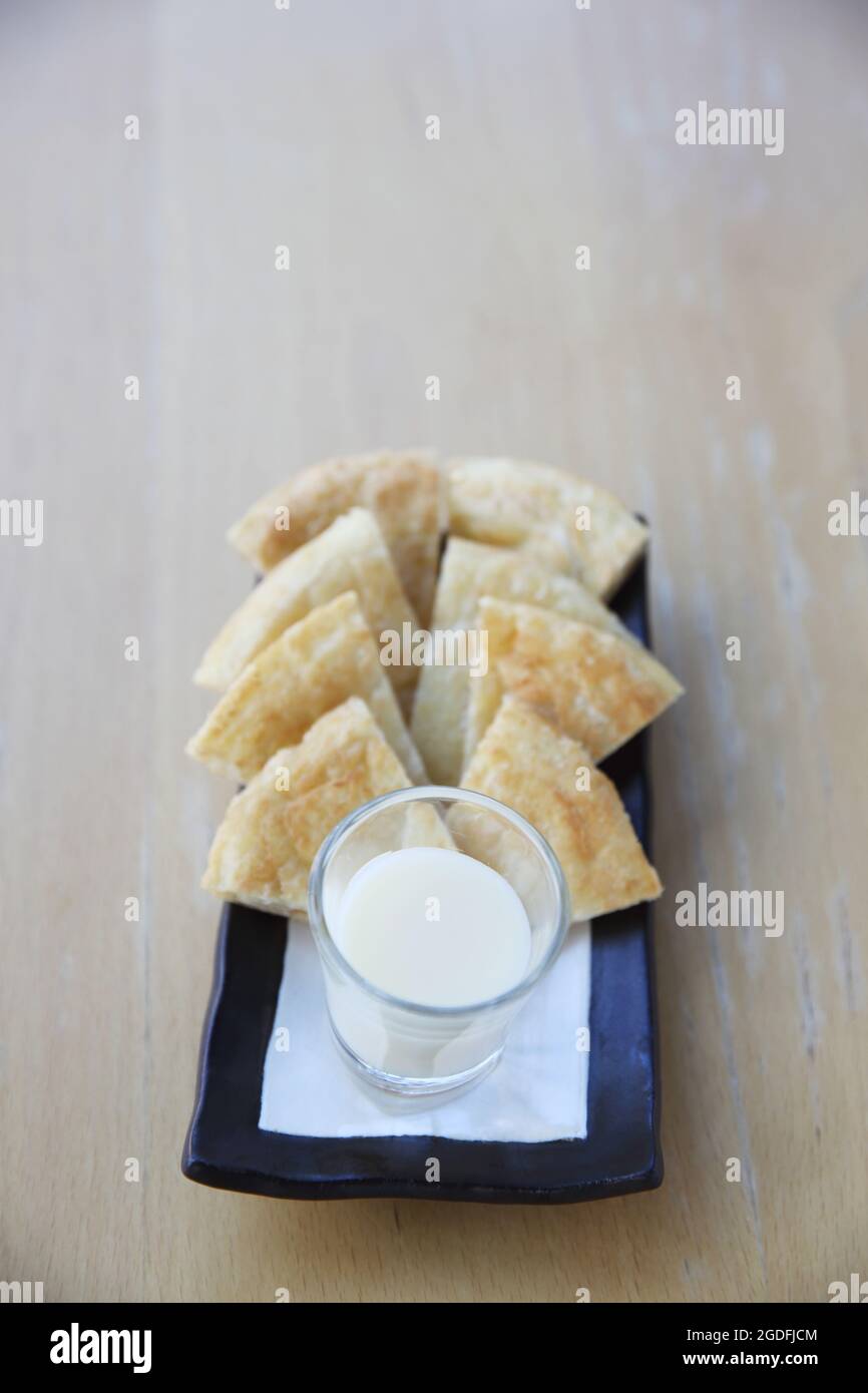 roti with milk on wood background Stock Photo - Alamy