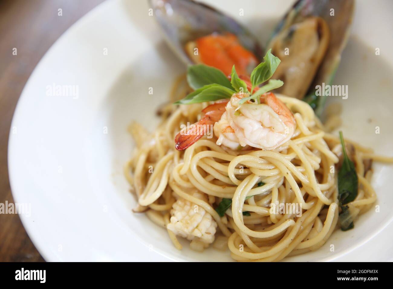 Spaghetti seafood with spicy Stock Photo - Alamy