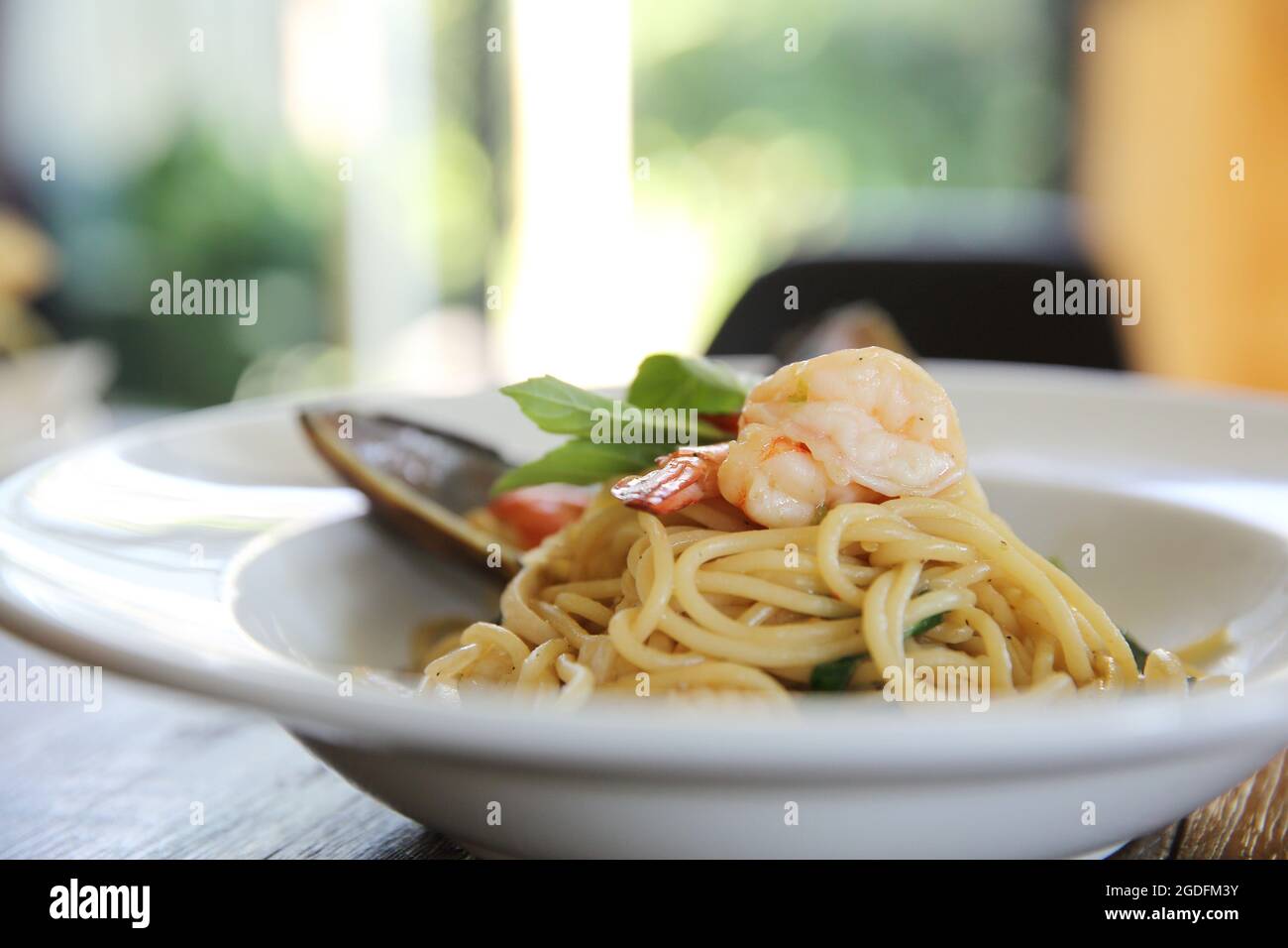 Spaghetti seafood with spicy Stock Photo - Alamy