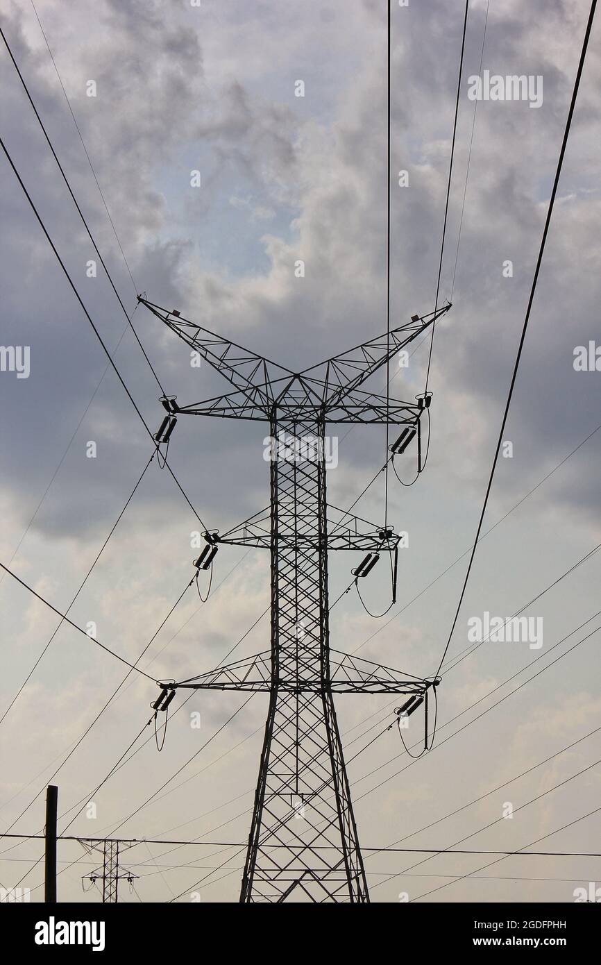 Huge giant power towers carrying technology and power and electricity ...