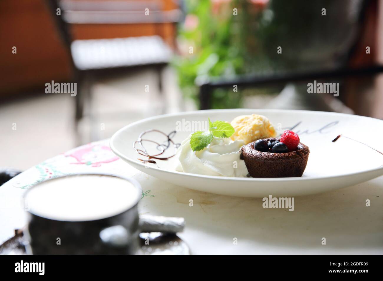 Chocolate lava cake and berries with ice cream Stock Photo - Alamy