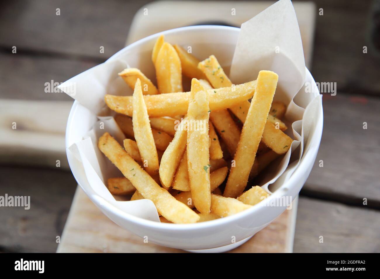 Fried potatoes french fries on wooden background Stock Photo - Alamy
