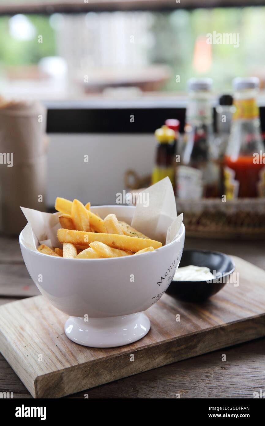 Fried potatoes french fries on wooden background Stock Photo - Alamy
