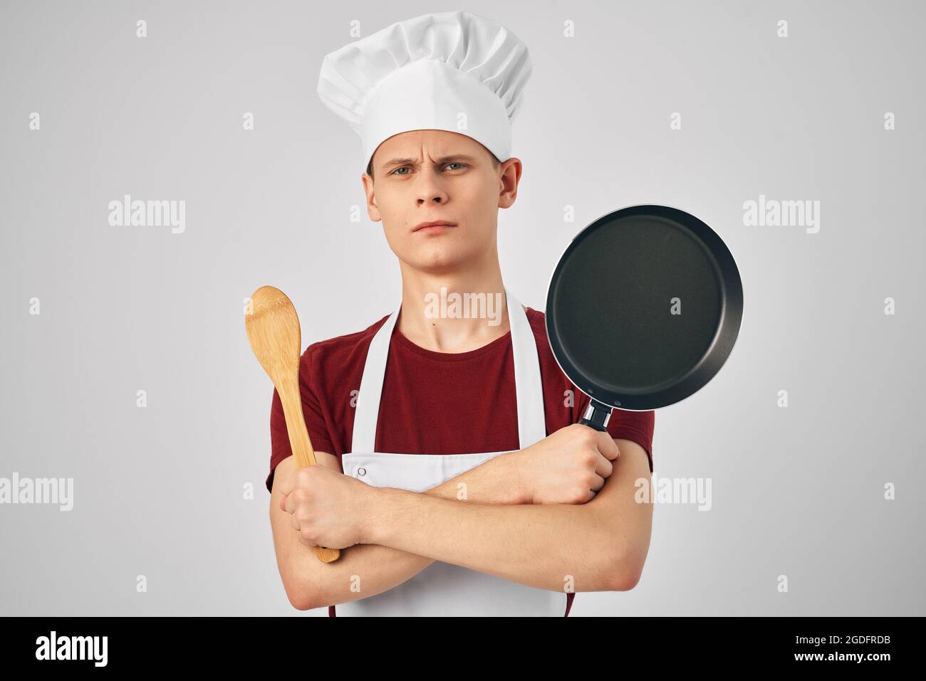 man in chef uniform kitchenware restaurant cooking Stock Photo - Alamy