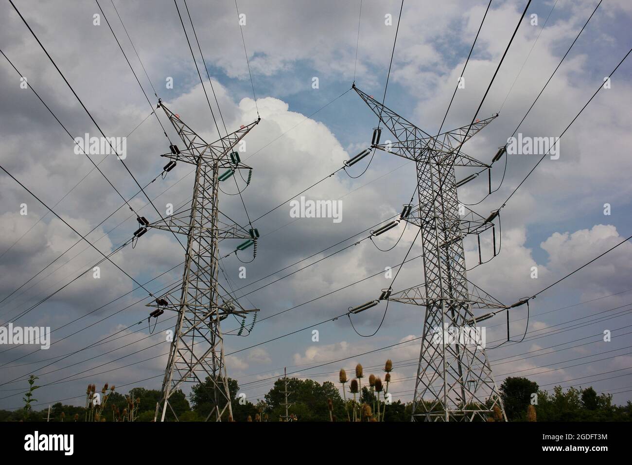 Huge giant power towers carrying technology and power and electricity ...