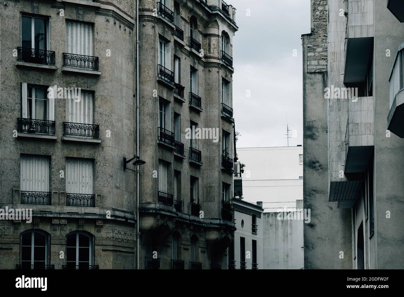 Facades of two buildings with windows facing each other - cloudy day ...