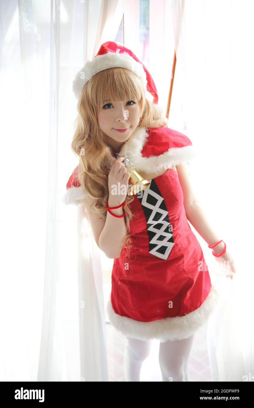Christmas asian woman portrait with christmas gift Stock Photo - Alamy