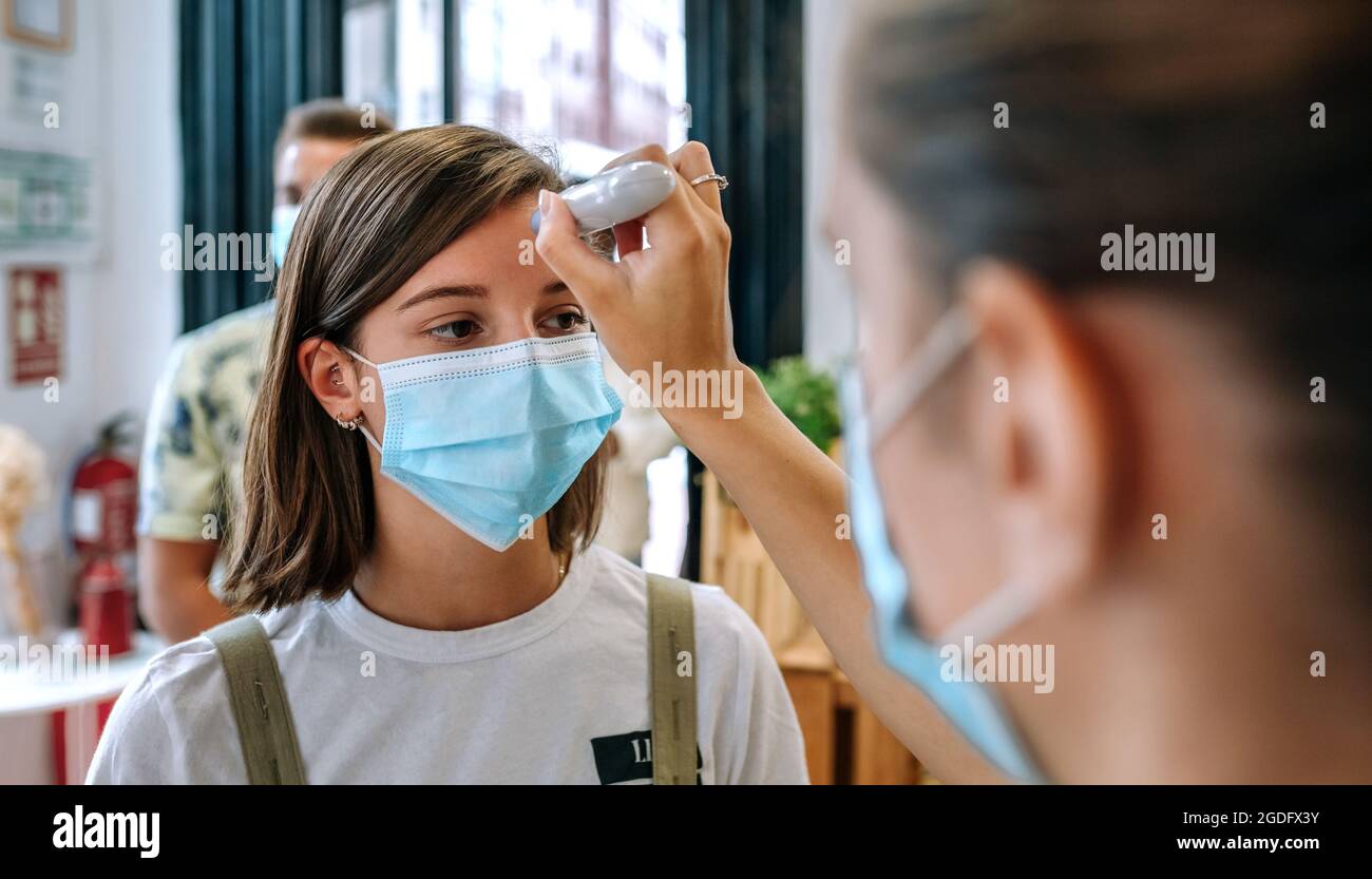 Young woman checking temperature thermometer hi-res stock photography ...