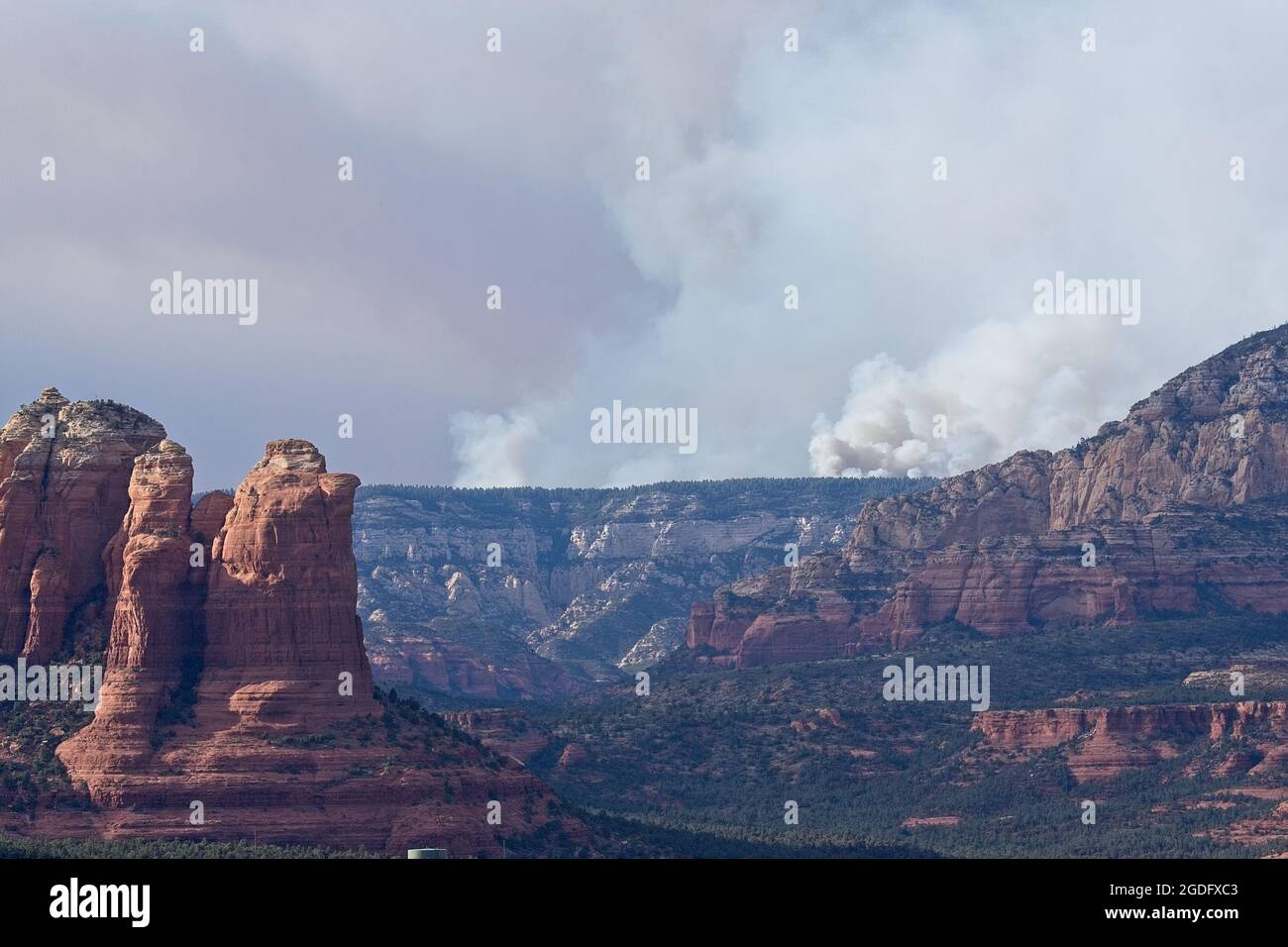 Fire in the distance in Oak Creek Canyon, Arizona during daylight Stock ...