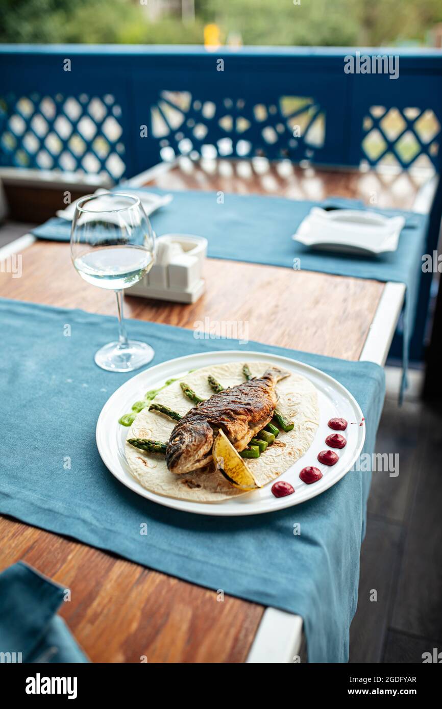 Dish of gourmet grilled dorada fish Stock Photo - Alamy