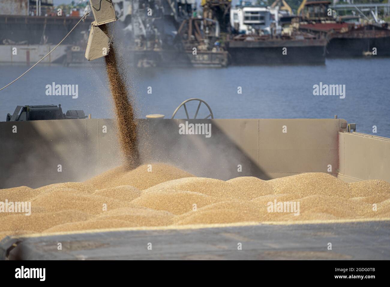 Closeup of the sand being poured into a large metal container Stock ...