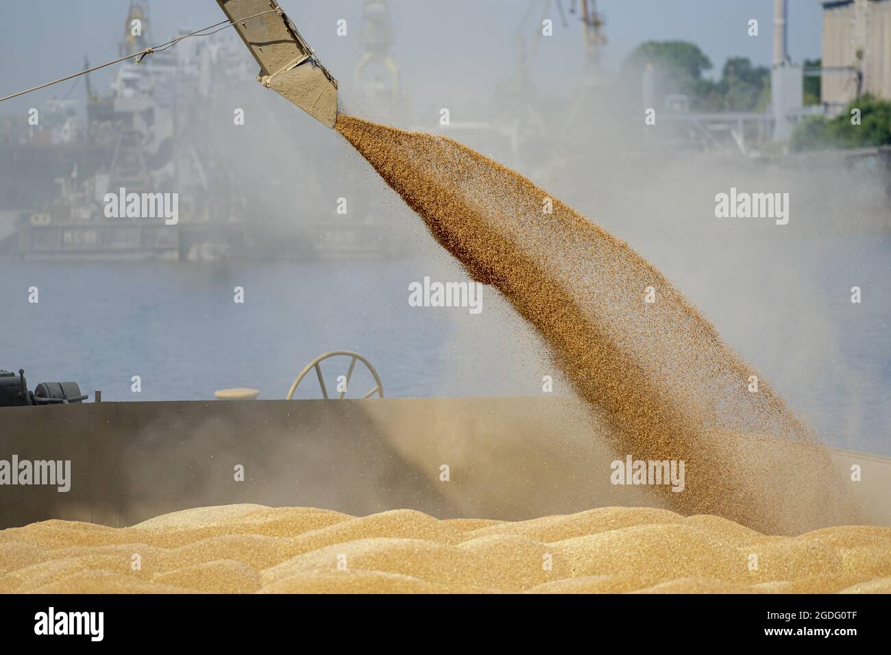 Closeup of the sand being poured into a large metal container Stock ...