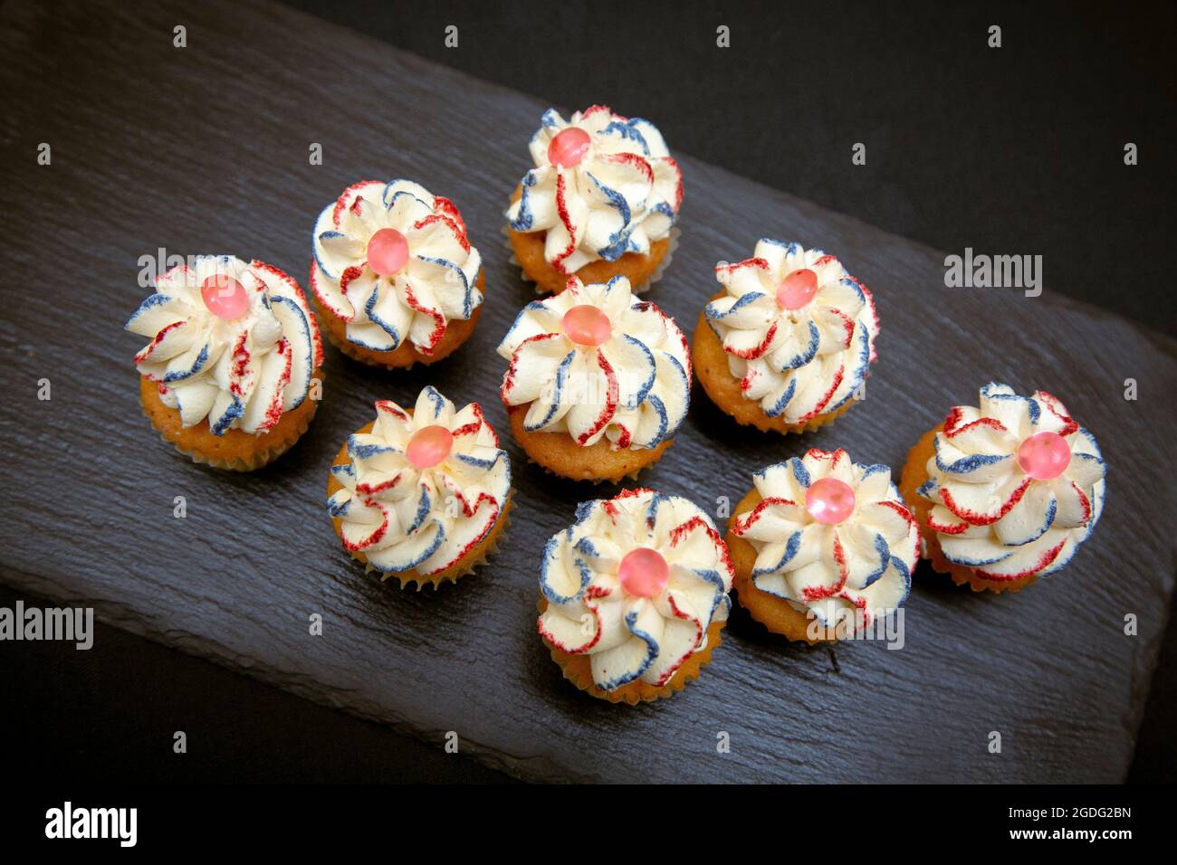 Small and festive celebration cupcakes in English colours by pastry ...