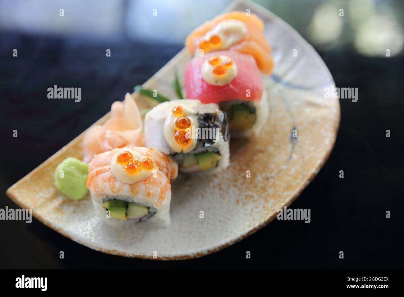 Mix maki sushi roll japanese food in black background Stock Photo - Alamy