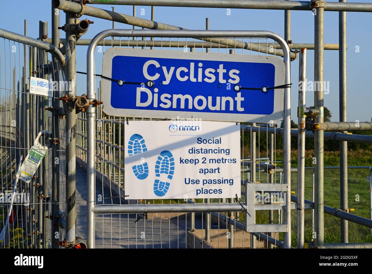 pedestrian and cycle access and social distancing warning sign through ...