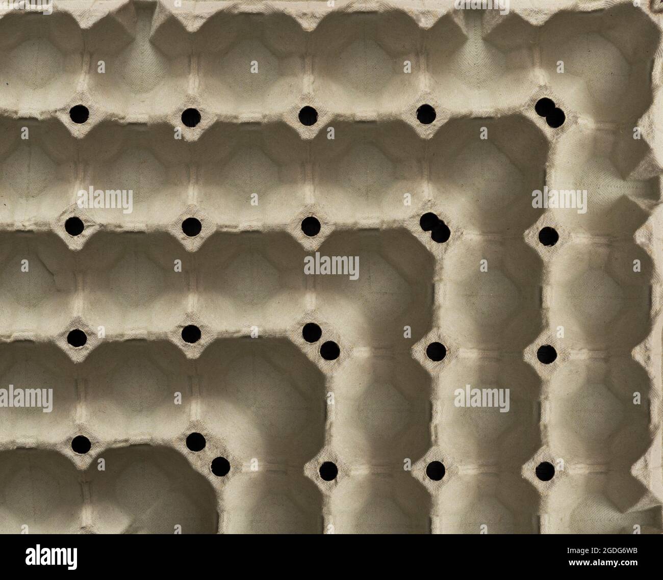 Cardboard formwork lit from side, above view, no egg, in L shape Stock ...