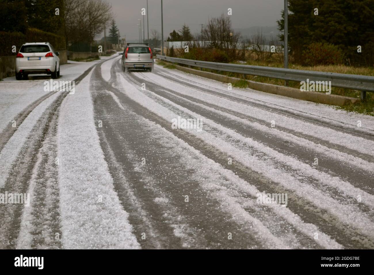 Road with hail that looks like snow Stock Photo - Alamy