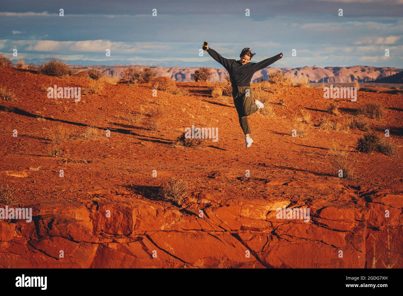 Woman jumping in desert hi-res stock photography and images - Alamy