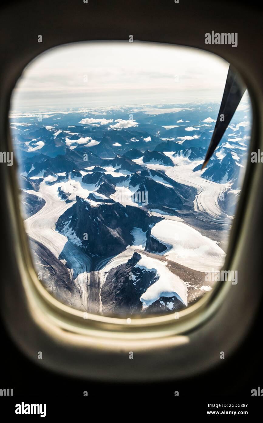 Aerial view of mountains and glaciers from plane window Stock Photo - Alamy