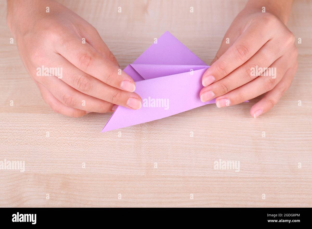Hands making origami figure, close up Stock Photo - Alamy