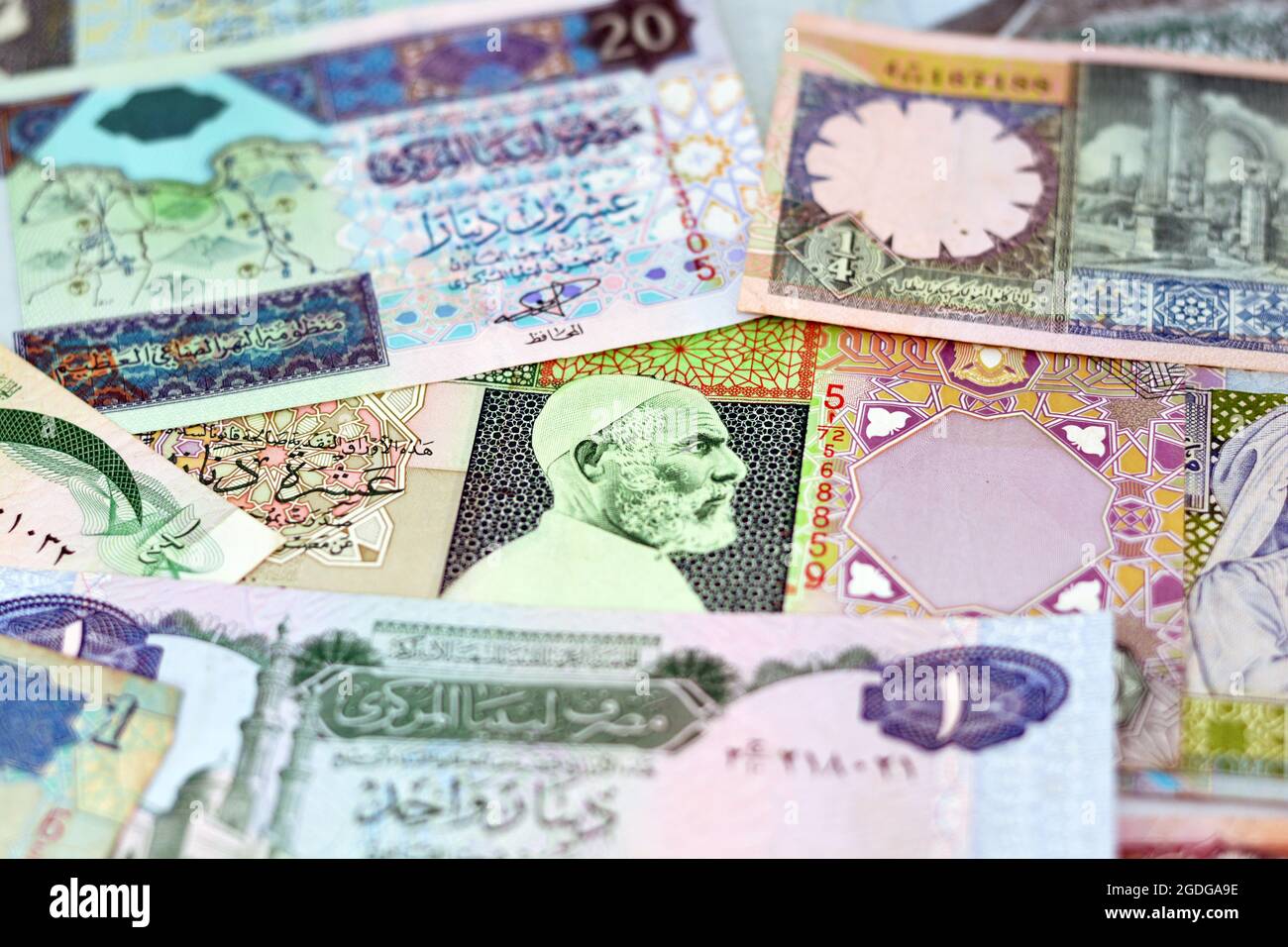 Background of Libyan money dinars banknotes with portraits of Omar Al ...