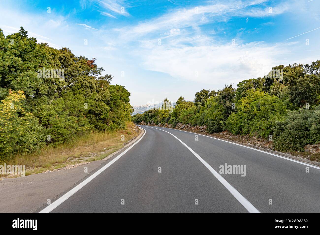 Scenic road. Road is surrounded by a magnificent natural landscape ...