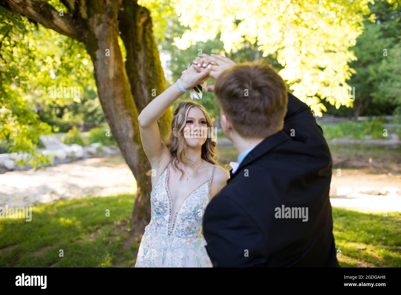Young attractive couple dancing, spinning in nature Stock Photo - Alamy