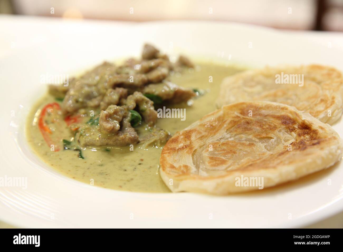 Roti with beef green curry Stock Photo - Alamy