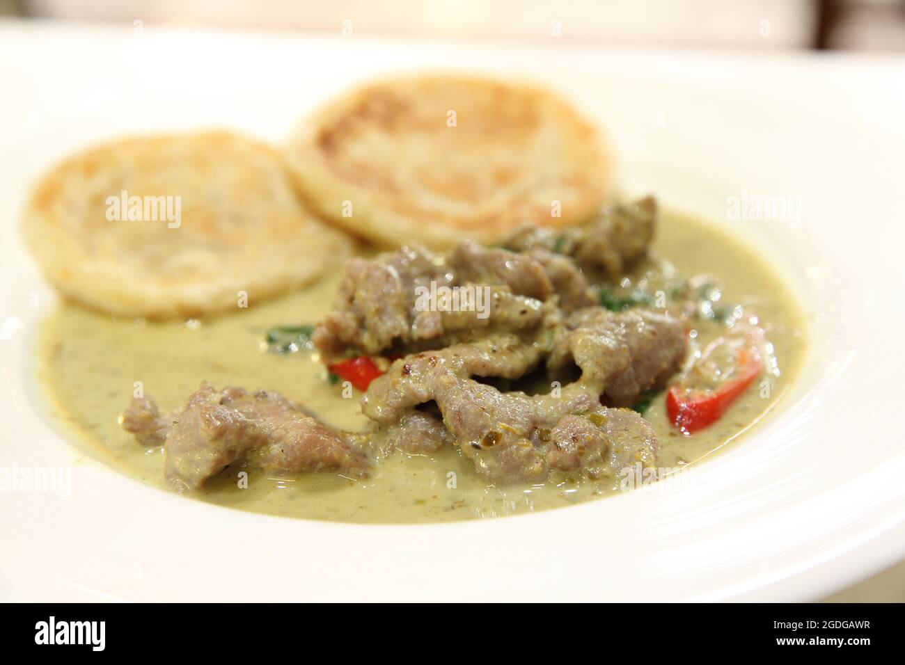 Roti with beef green curry Stock Photo - Alamy