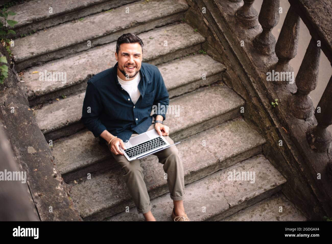 Businessman laptop computer on stairs hi-res stock photography and ...