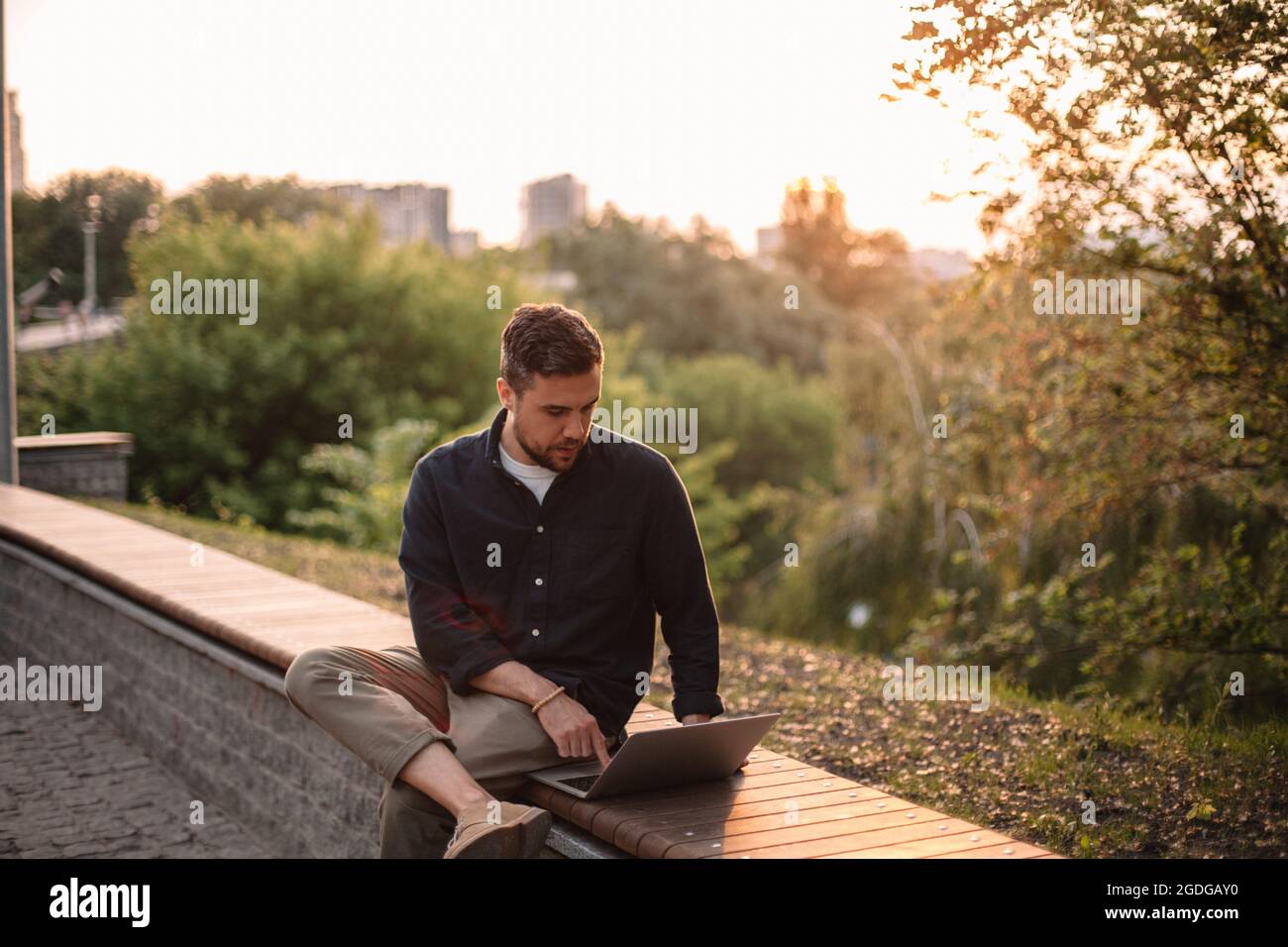 Concentrated man sitting on bench hi-res stock photography and images ...